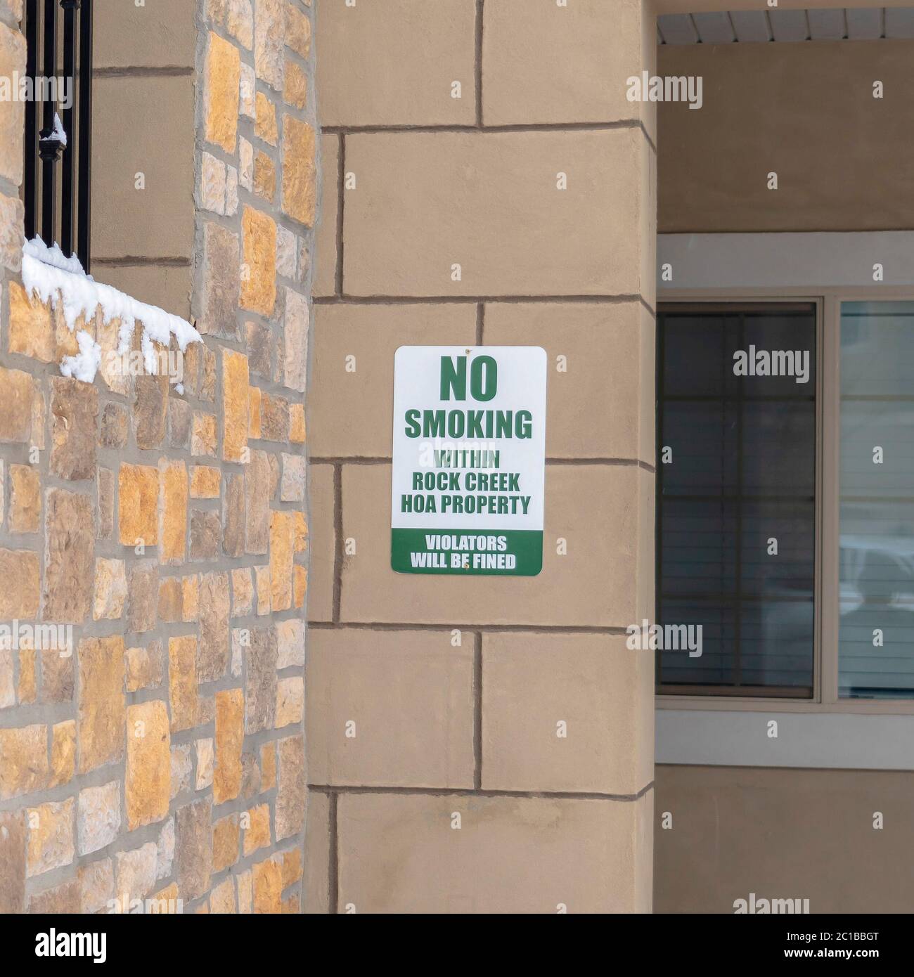 Square Exterior view of apartments with No Smoking sign on the stone ...