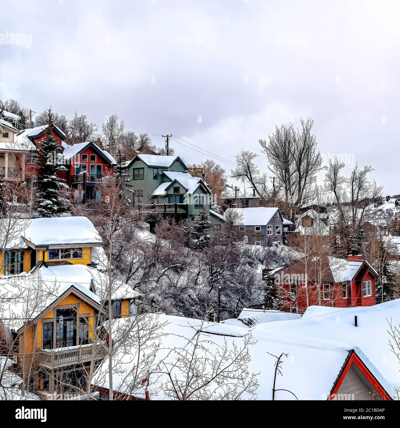 Square Cloudy sky over scenic neighborhood community nestled on snowy ...