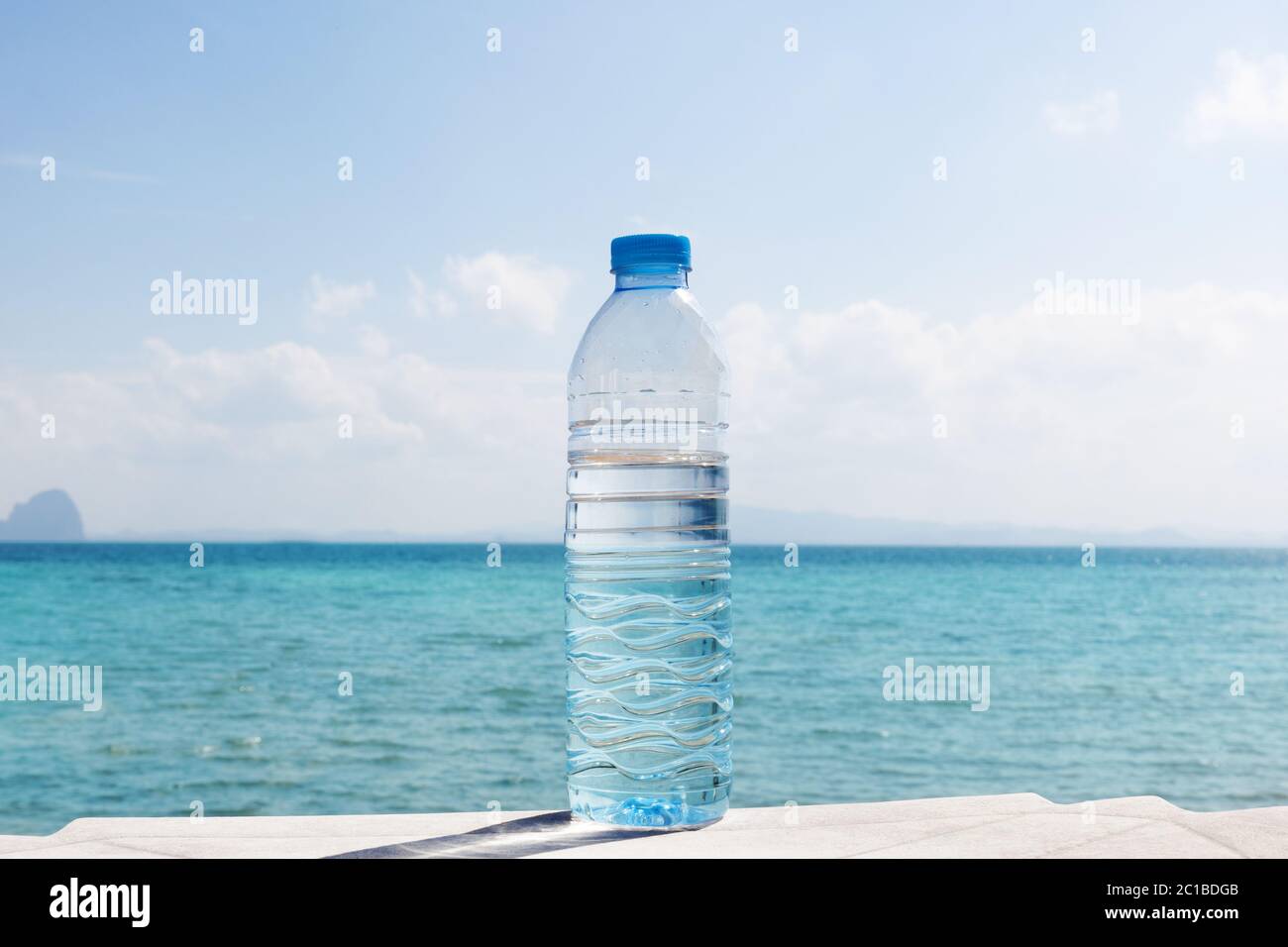 Water bottle on tropical beach Stock Photo - Alamy