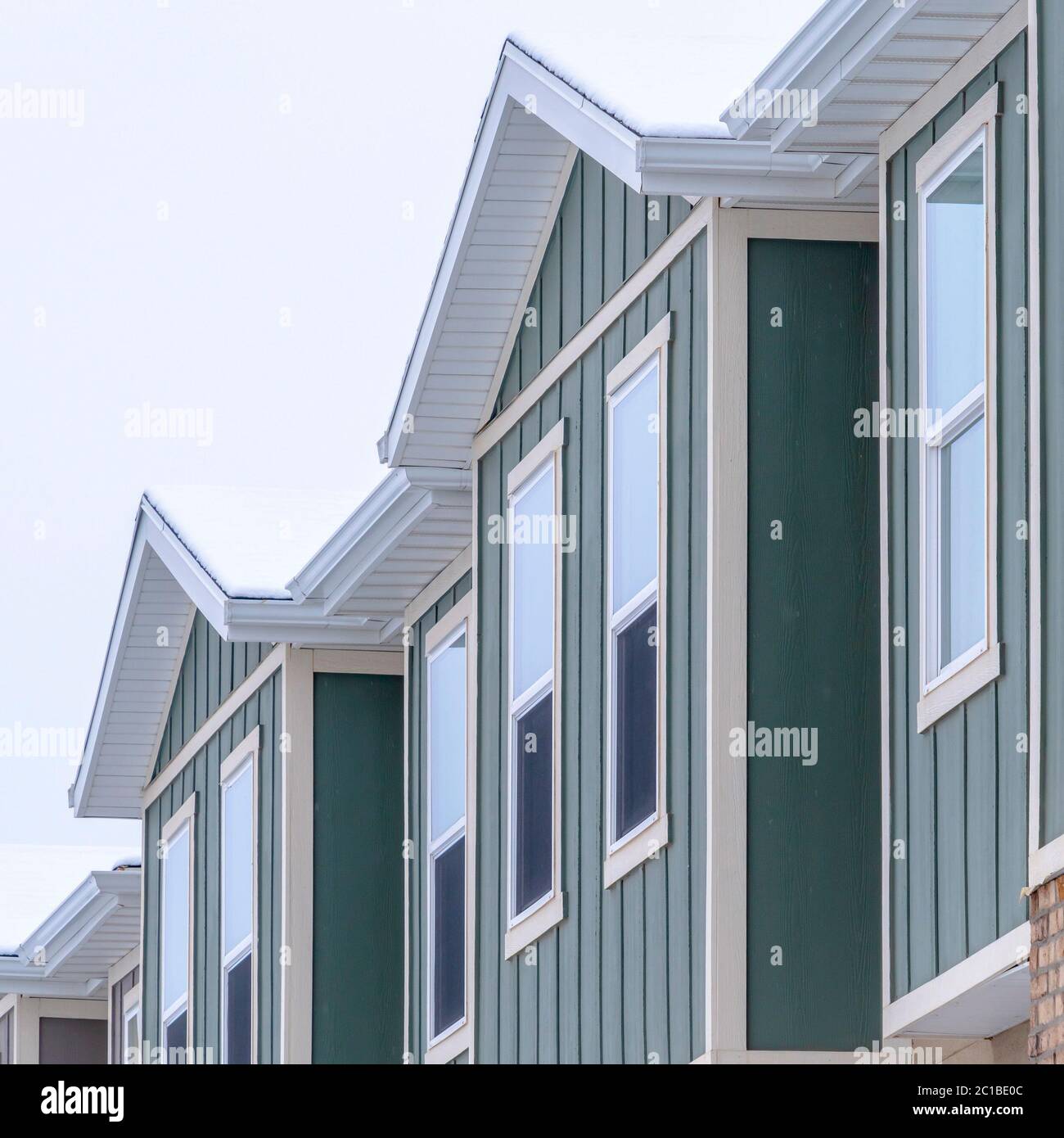 Square frame Vertical siding and stone brick wall at the townhomes ...