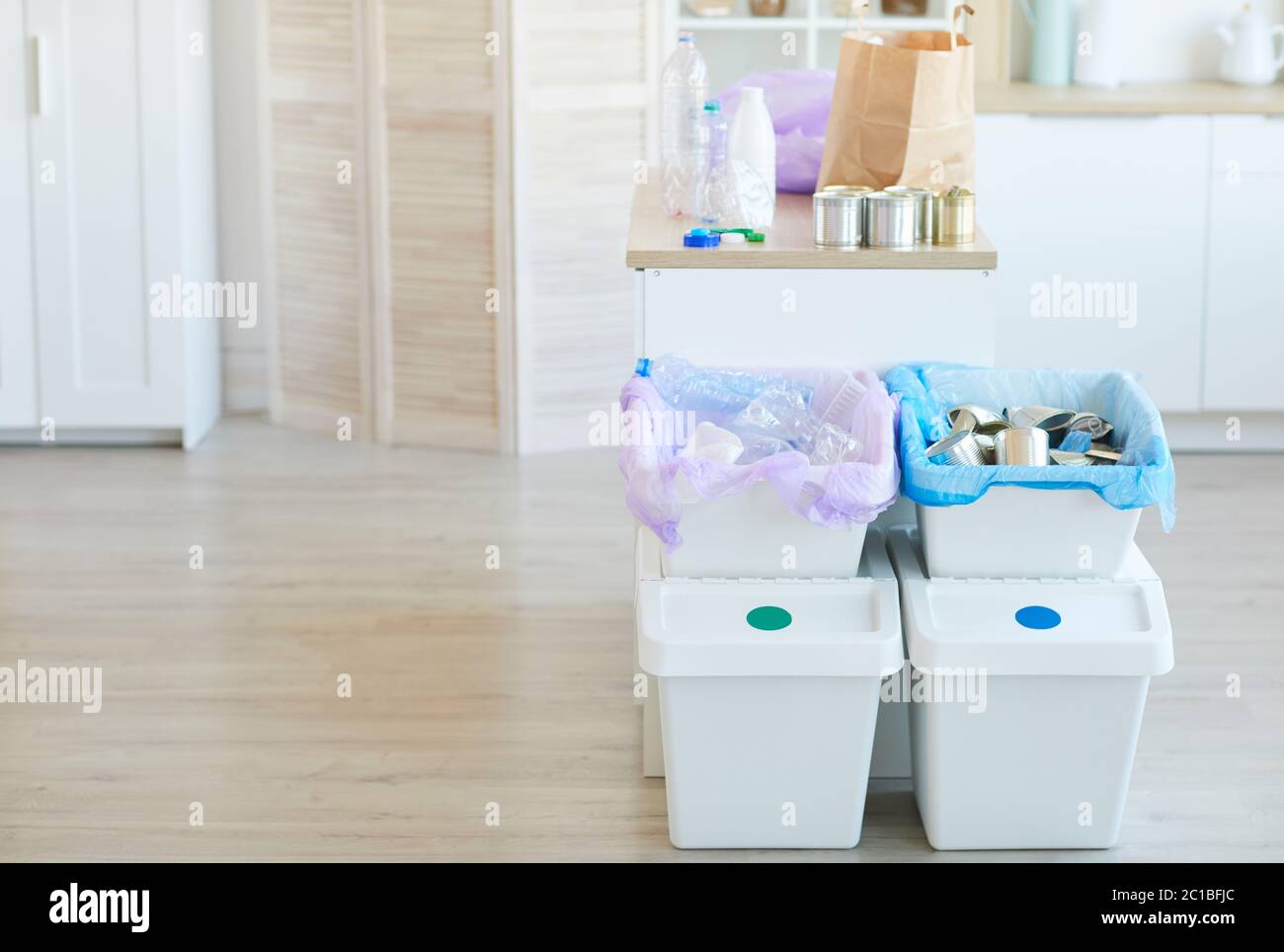 Group of bins with different sorted garbage in the domestic room Stock ...
