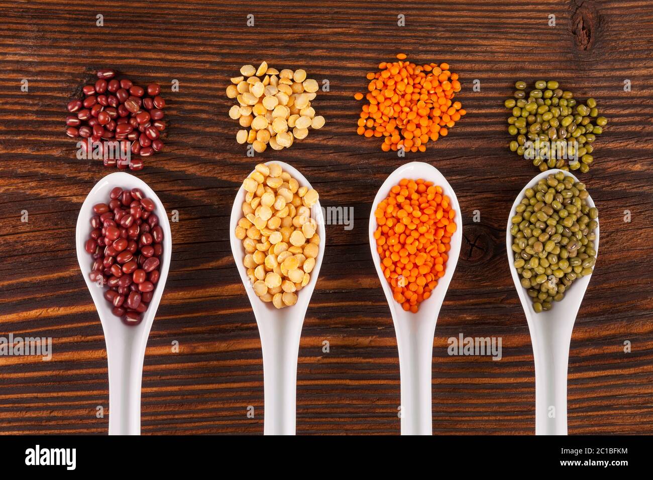 Fresh legumes in spoons Stock Photo - Alamy