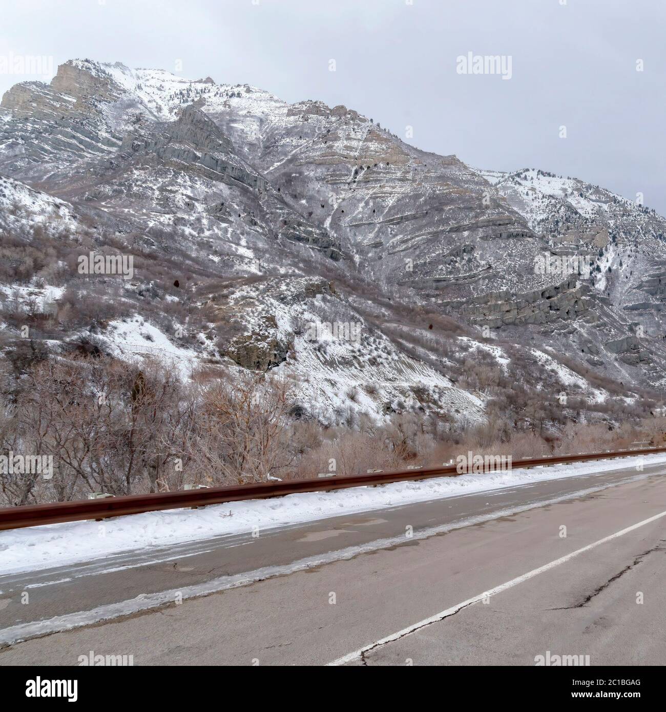 Square crop Road along steep snowy mountain in Provo Canyon with cloudy ...