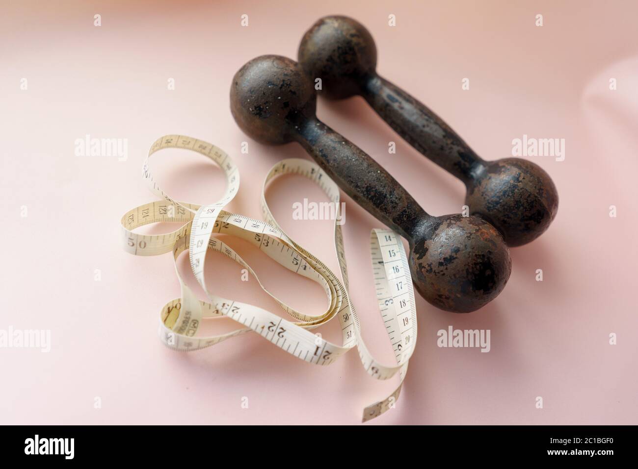 Dumbbells and Tape Measure, Fitness Concept Stock Photo - Alamy