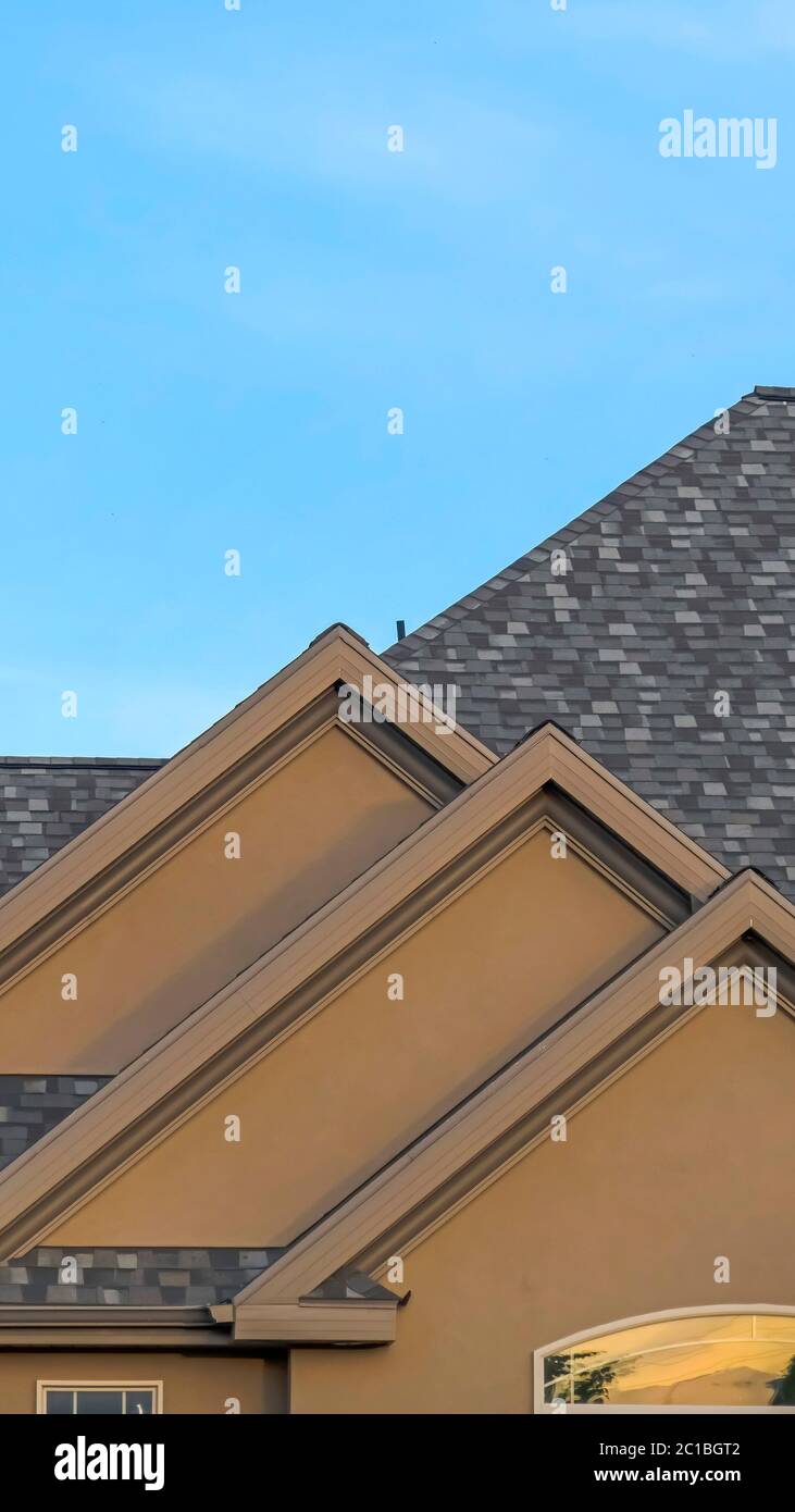 Vertical frame Home exterior with front gable roof and transom window ...