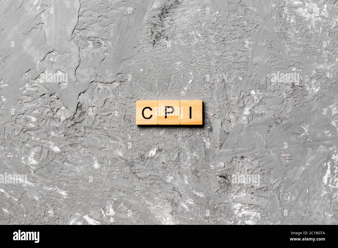 CPI word written on wood block. abbreviation consumer price index text ...
