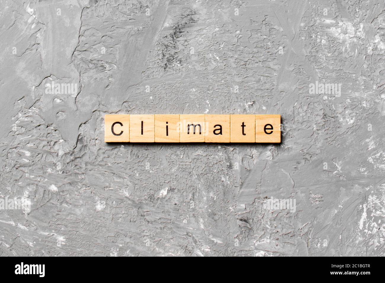 climate word written on wood block. climate text on cement table for ...