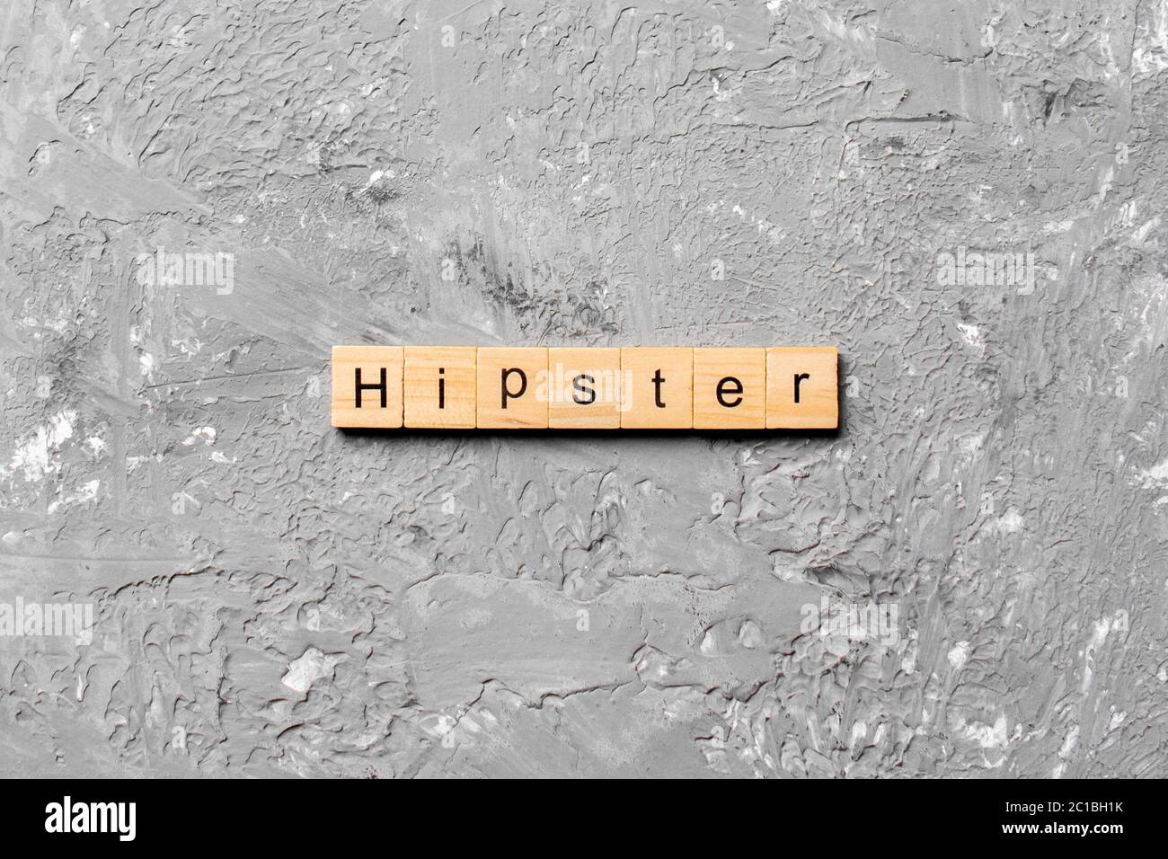 Hipster word written on wood block. Hipster text on cement table for ...