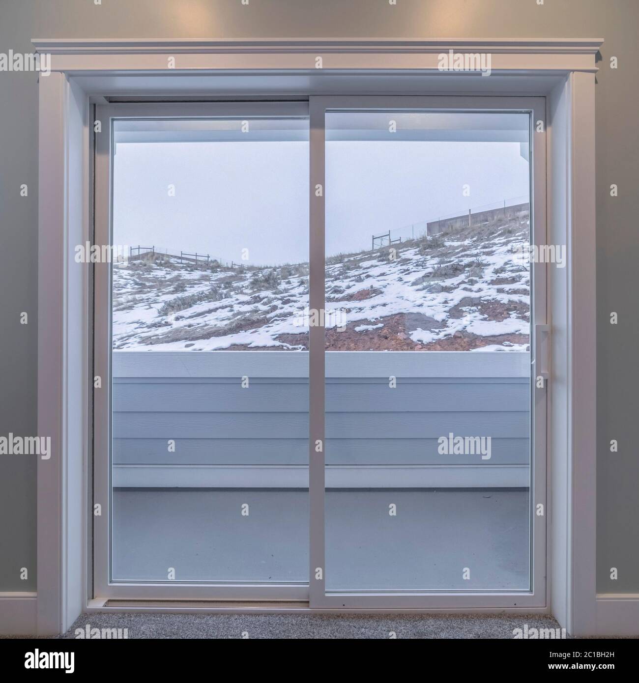 Square Glass door leading to an external balcony Stock Photo - Alamy