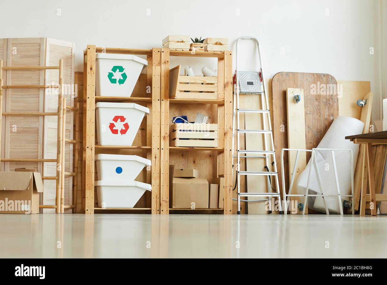 Image of trash bins on the wooden shelves in the warehouse Stock Photo ...