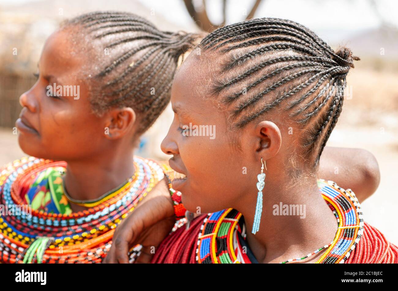 Close up portrait of two Maasai women smiling, members of the Samburu ...