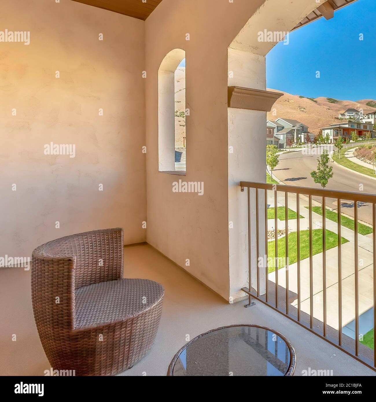 Square crop Balcony of home with wicker chair round glass table and ...