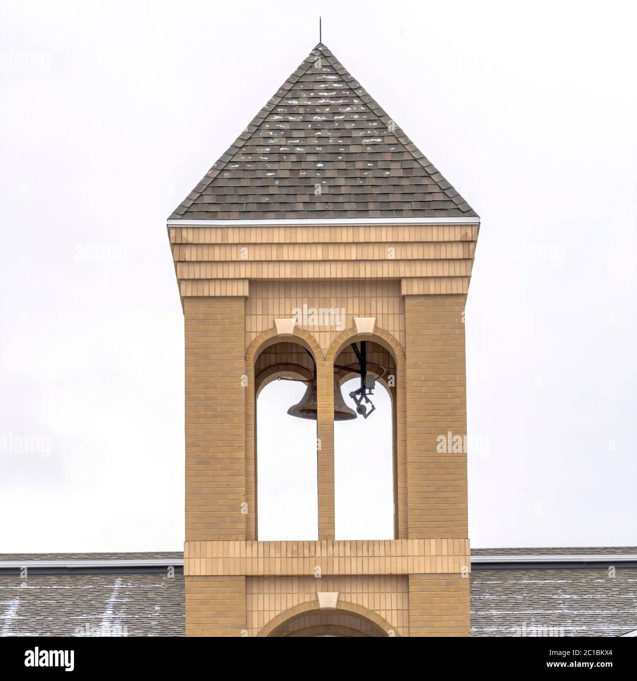 Square crop Modern belfry tower of a religious building with roof and ...