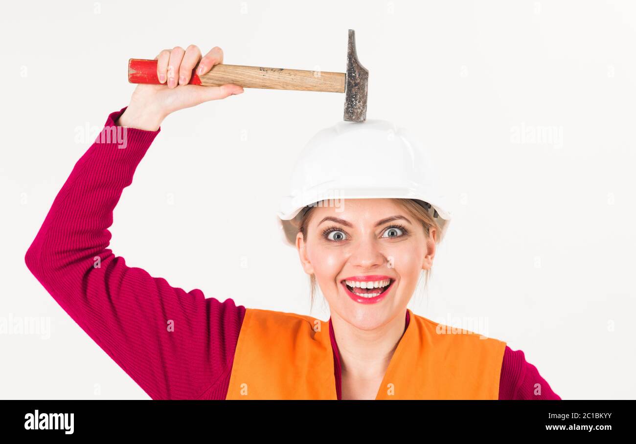 Beautiful engineering woman using hammer and tools in white background ...
