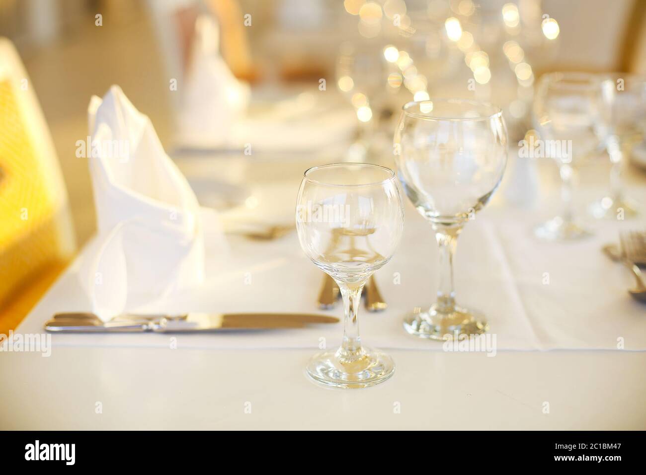 Glasses and plates on the tables Stock Photo - Alamy