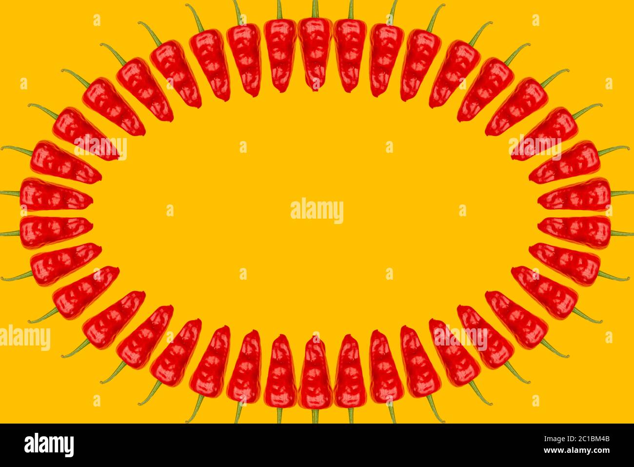 Red chili pepper circle texture pattern on yellow background with copy ...