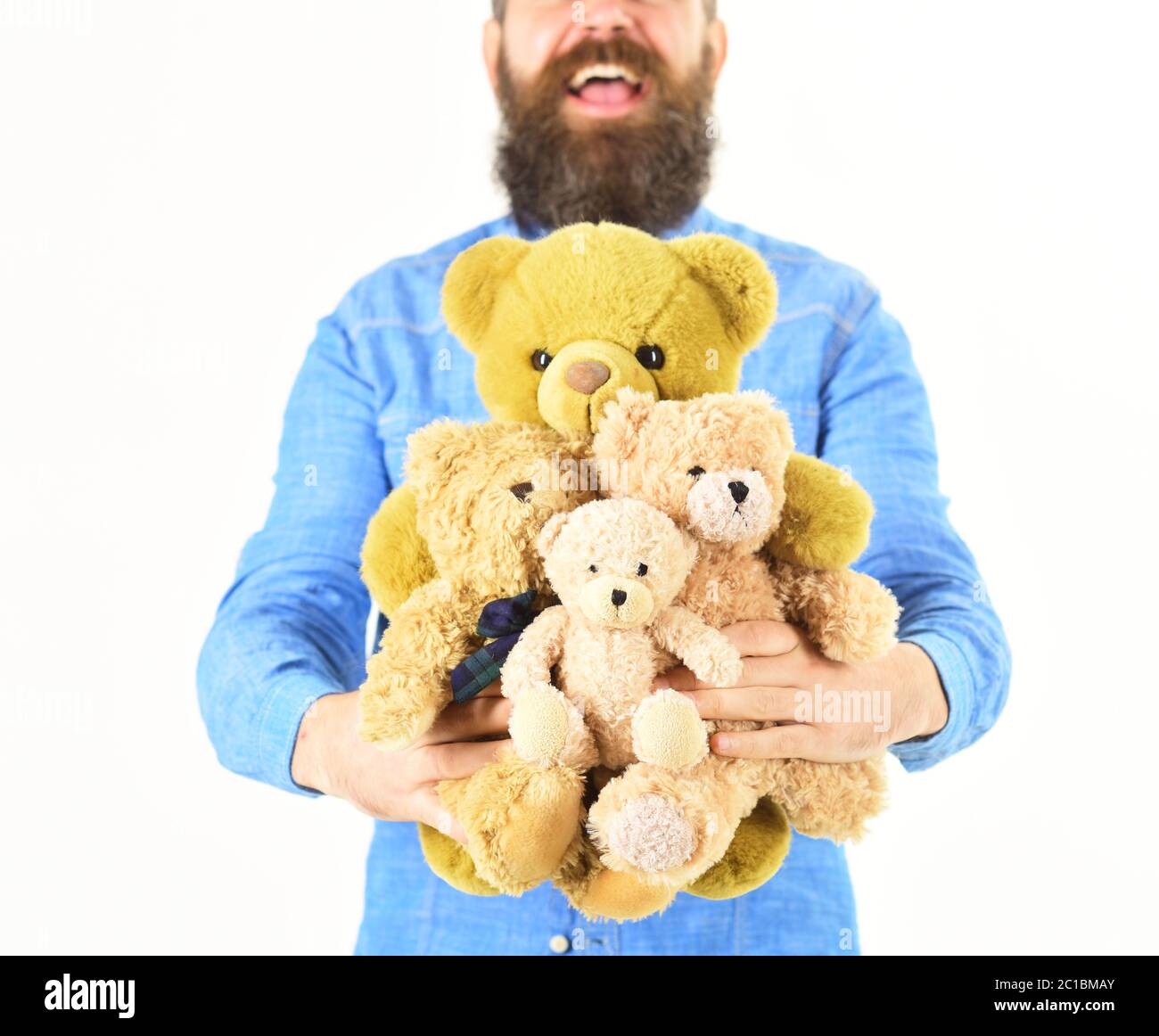 Kids toys in hands of loving father isolated on white background. Cute ...