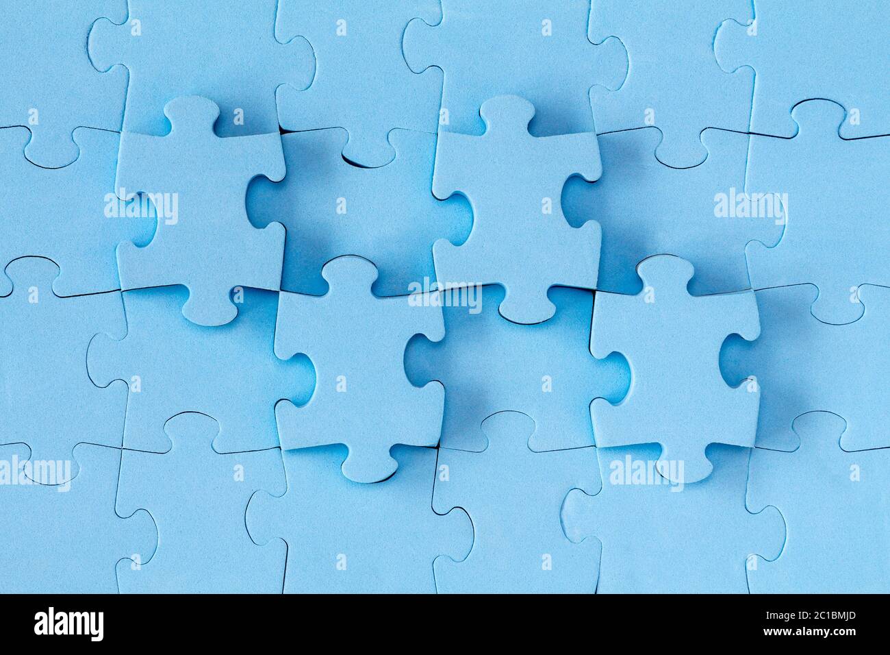 Background made of blue puzzle pieces Stock Photo - Alamy