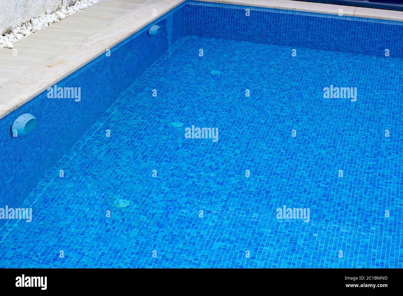 Blue swimming pool in a resort Stock Photo - Alamy