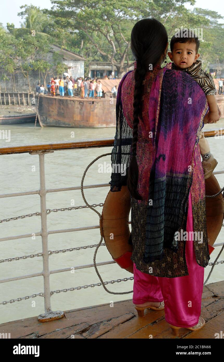 A mother and child standing on the deck of the Rocket paddle steamer as ...