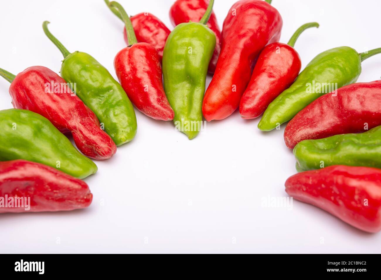 Red and green chillies close up on white background - farm fresh Stock ...