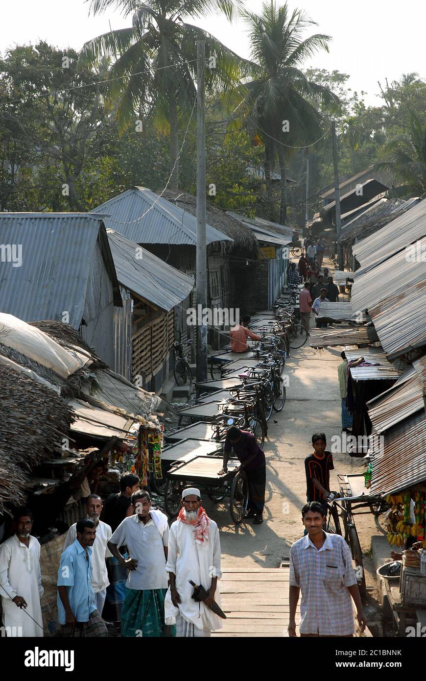 Ganges Delta in Bangladesh: A group of people waiting at the dock in a ...