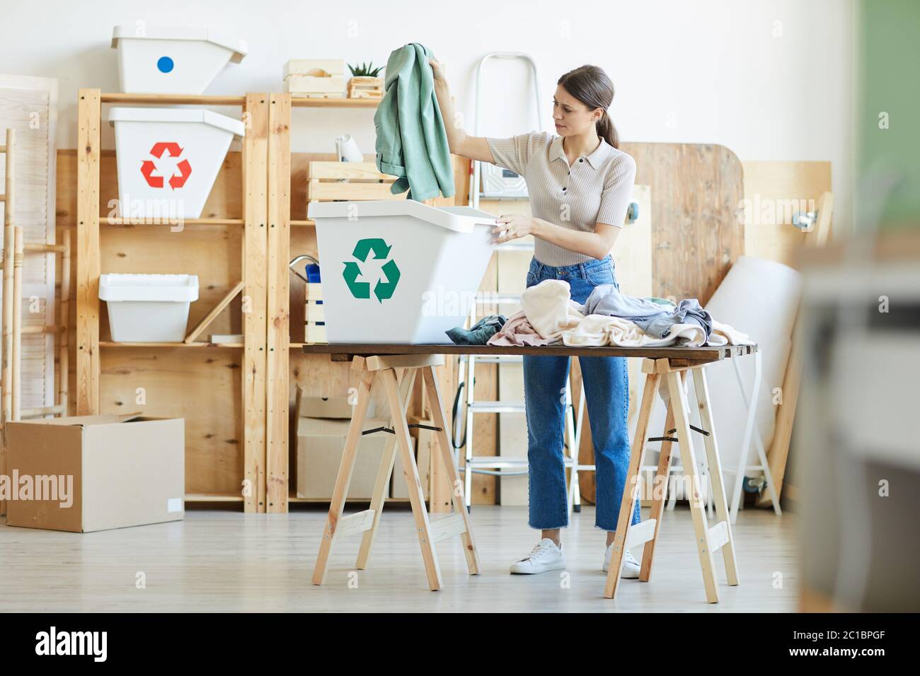Woman sorting out wardrobe hi-res stock photography and images - Alamy