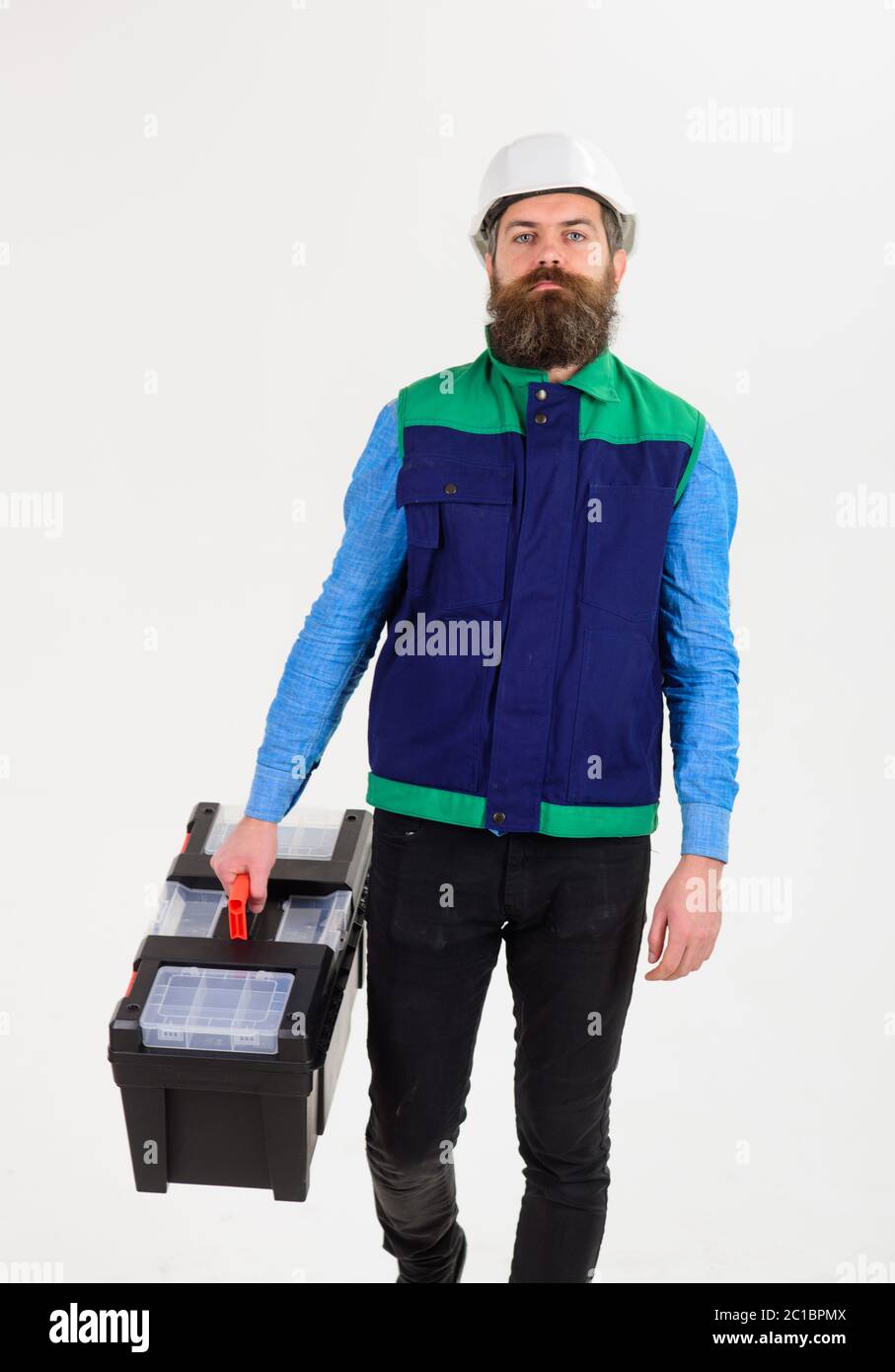 Man with beard and mustache holds toolbox isolated on white background ...
