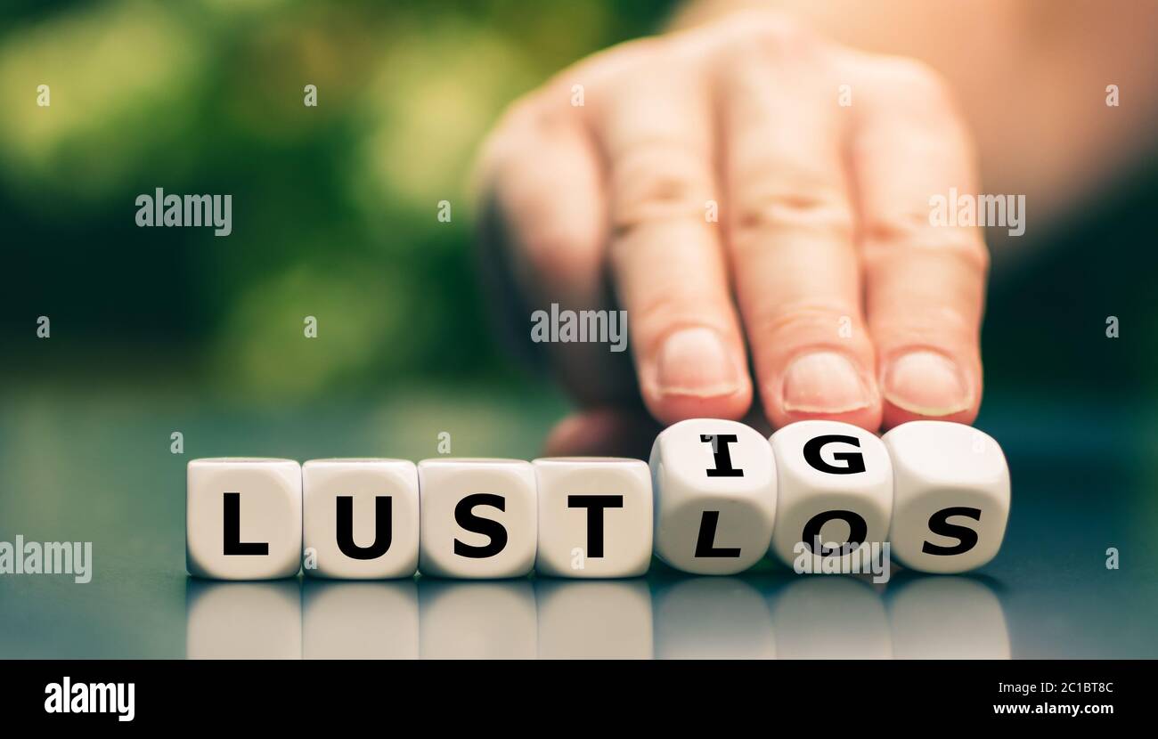 Hand turns dice and changes the German word "lustlos" ("listless") to ...