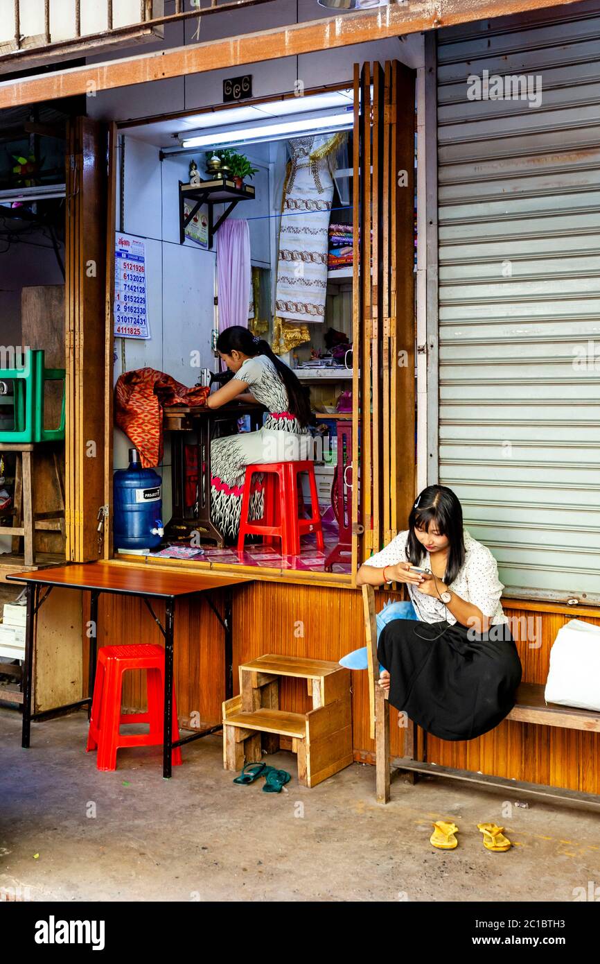 A Woman Using A Sewing Machine In A Clothes Repair Shop, Bogyoke Aung ...