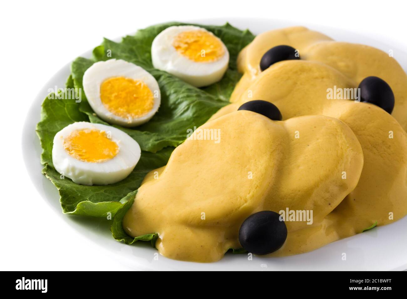 Traditional Peruvian papa a la huancaina isolated on white background ...