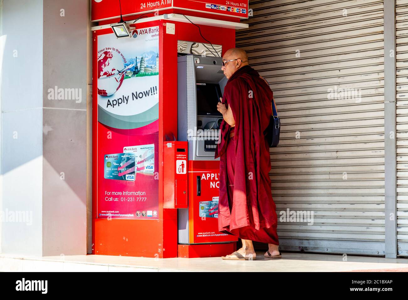 Buddhist monk at atm machine hi-res stock photography and images - Alamy