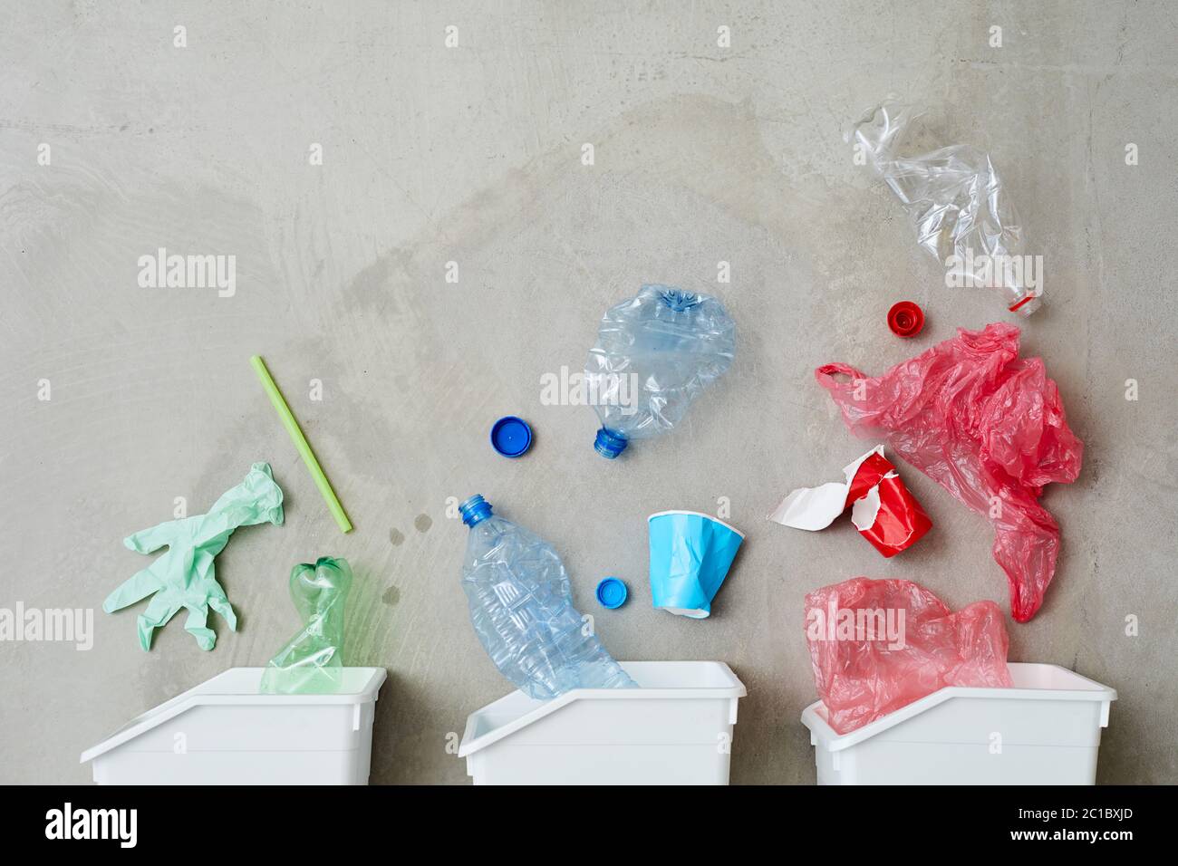 Image of three trash bins with sorted garbage isolated on grey ...