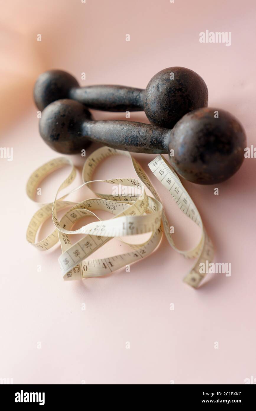 Dumbbells and Tape Measure, Fitness Concept Stock Photo - Alamy