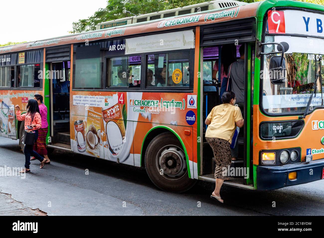 Local People Getting On A Bus, Yangon, Myanmar Stock Photo - Alamy