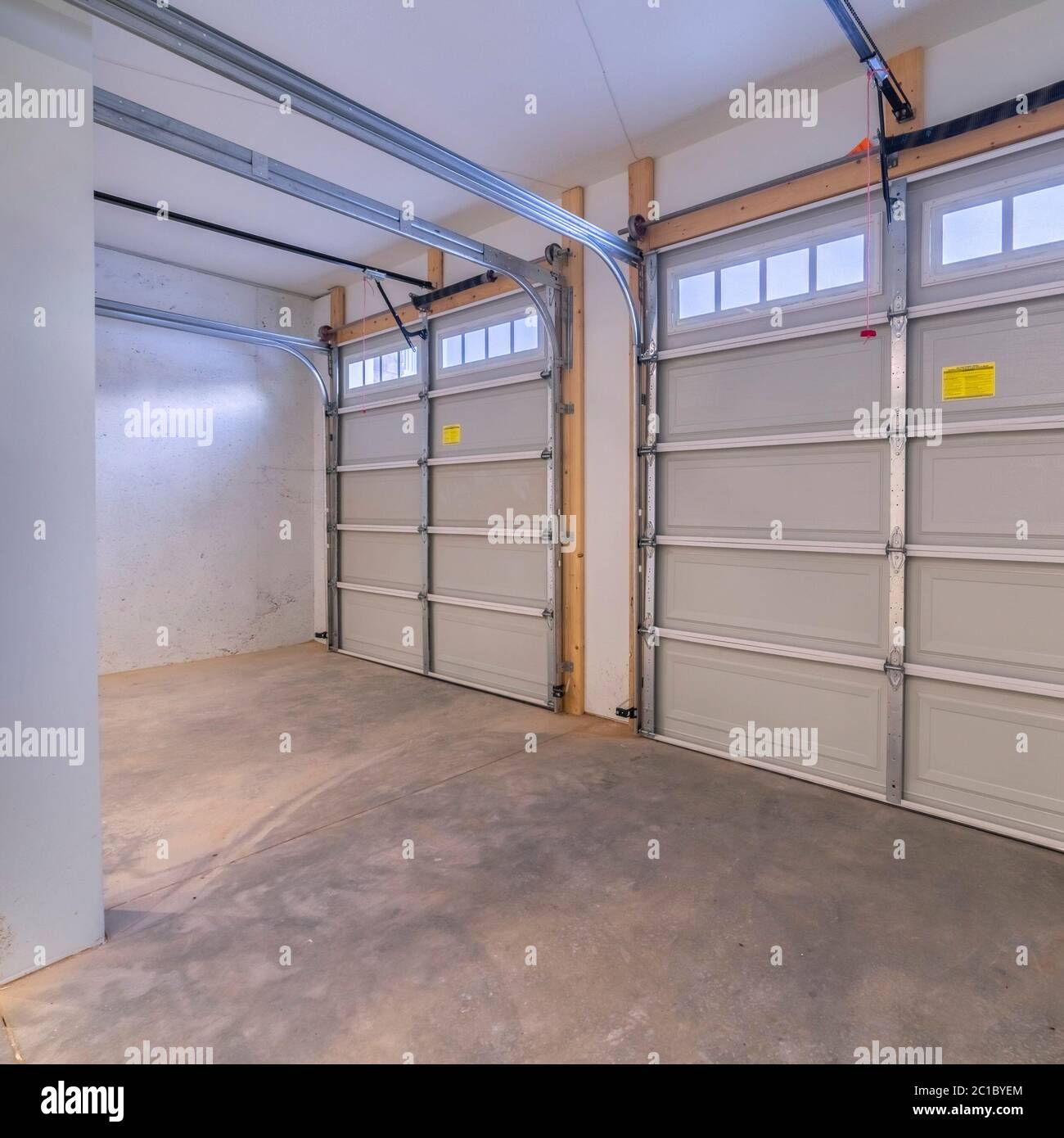 Square crop Inside an empty closed garage interior door Stock Photo - Alamy