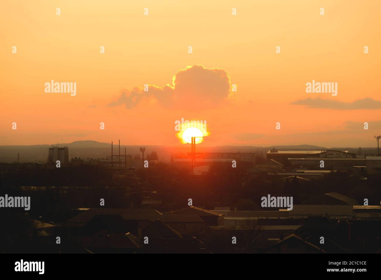 Sunrise at small town Sunset against the silhouette of the city Stock ...
