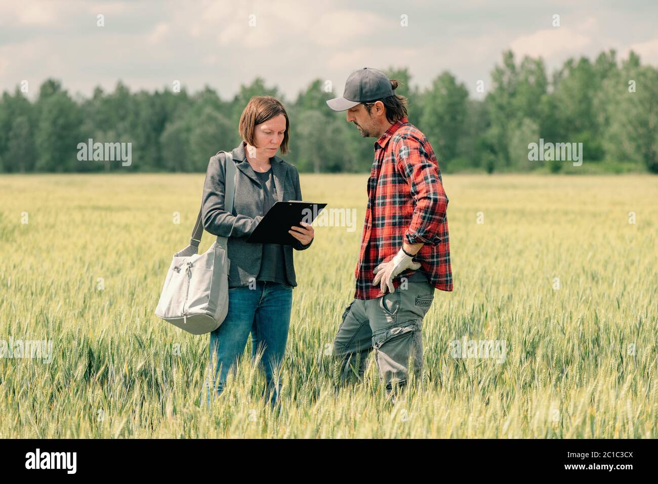Mortgage loan officer assisting farmer in financial allowance ...