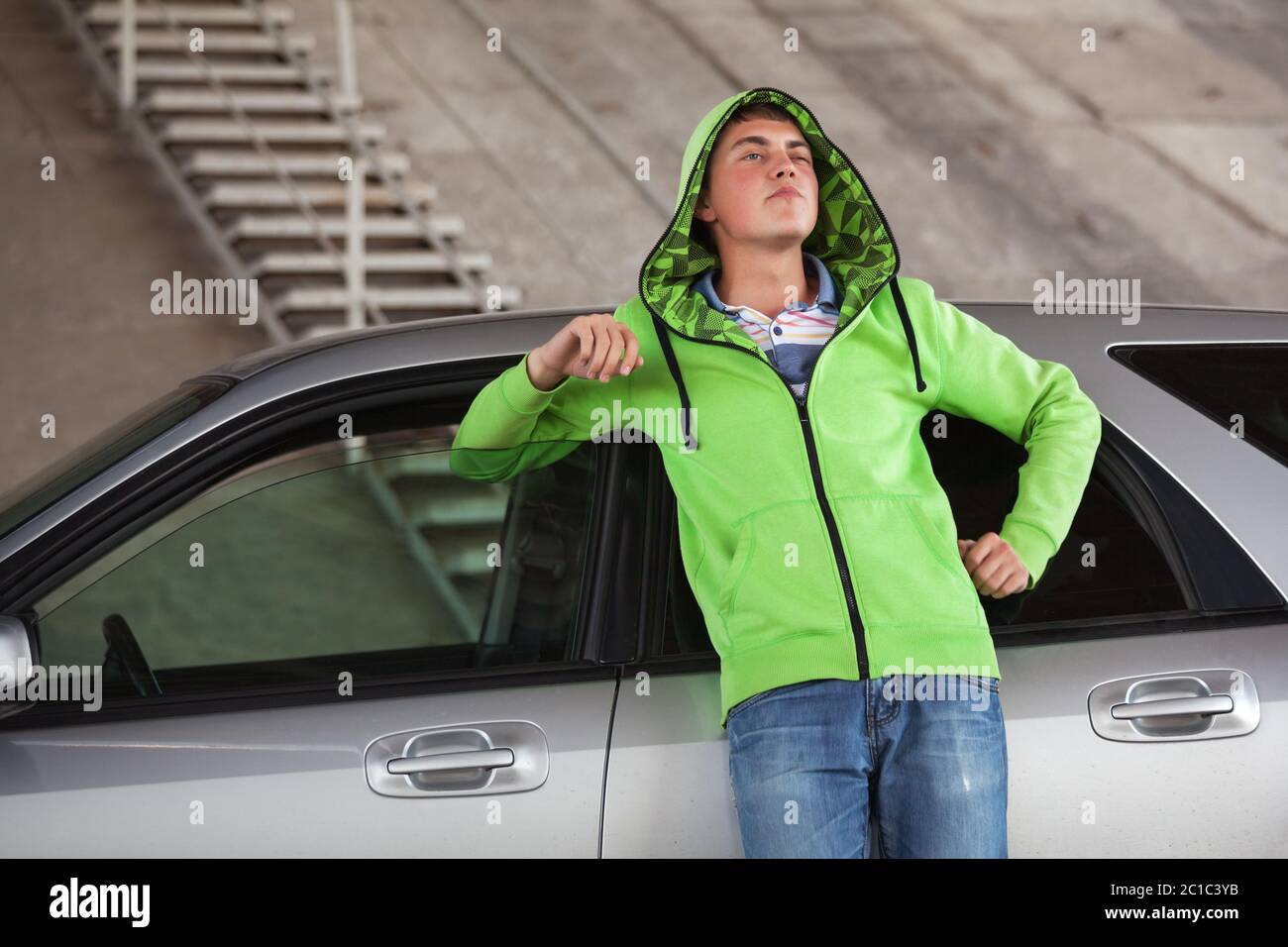 Sad young man in depression standing next to his car outdoor Stock ...