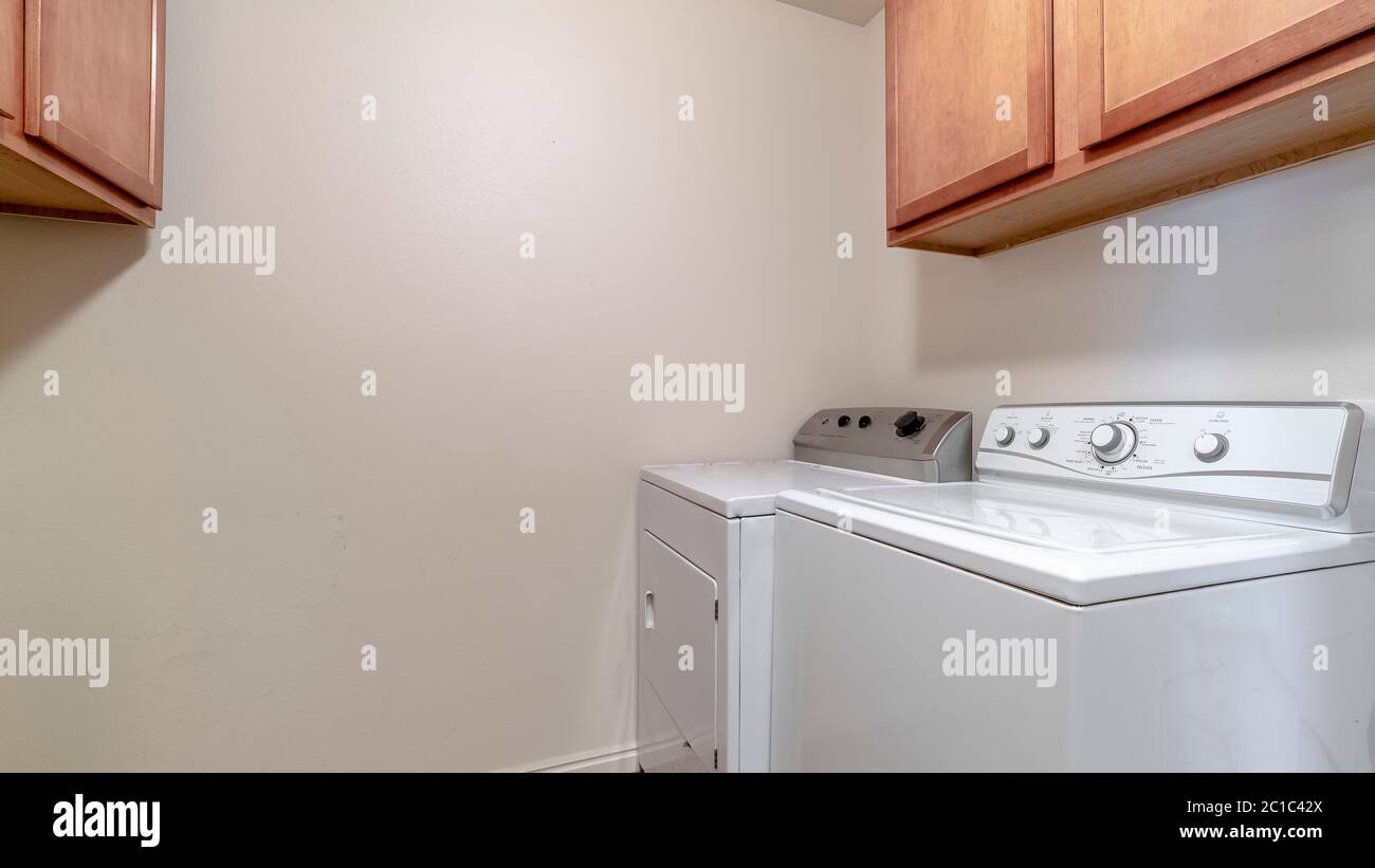 Panorama Laundry interior with washer and dryer interior Stock Photo ...