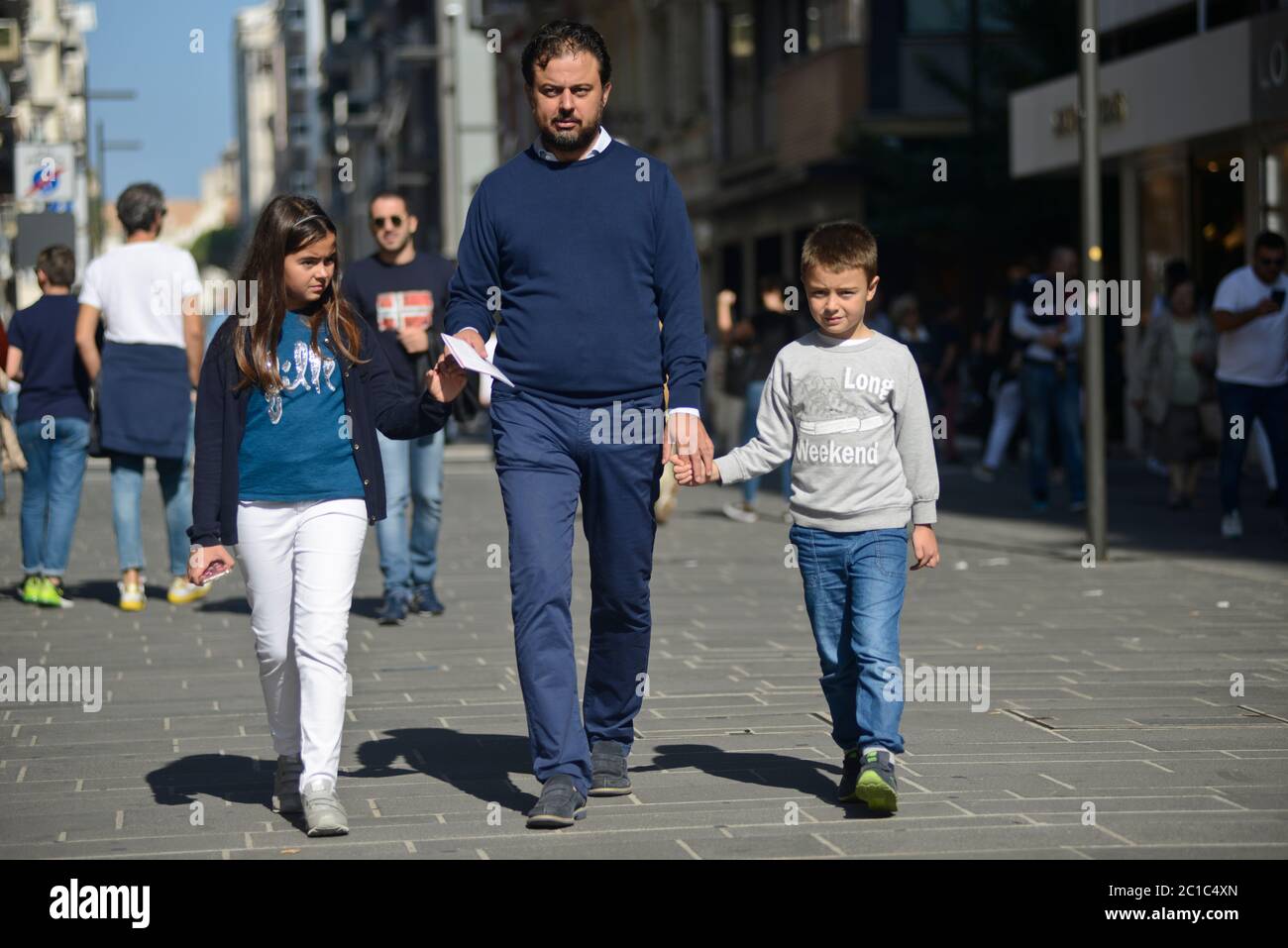 Italian father with his children walking in Via Sparano da Bari. Bari ...