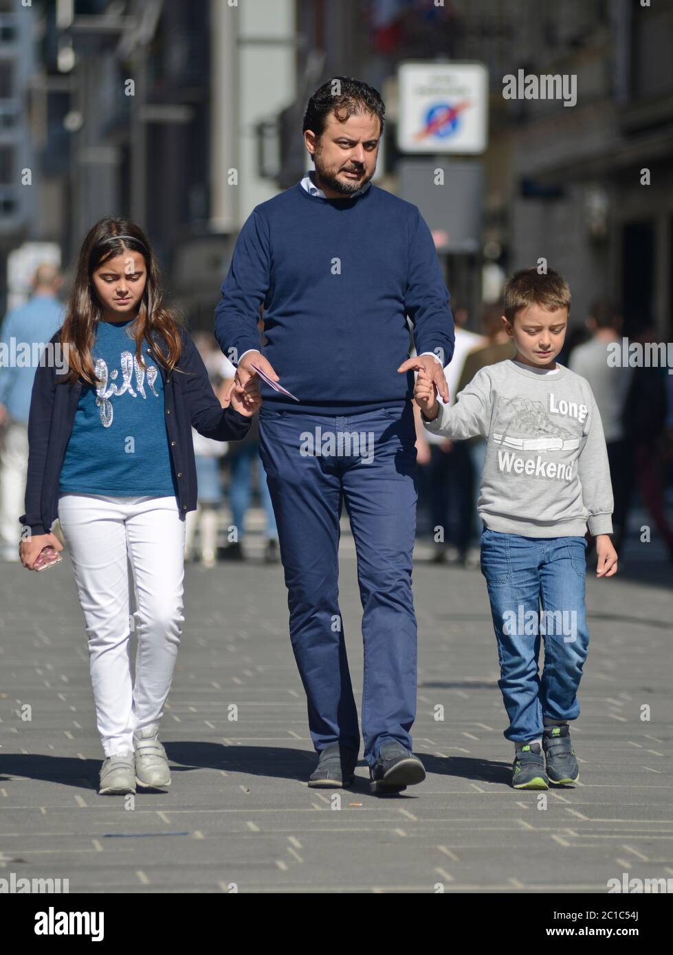 Italian father with his children walking in Via Sparano da Bari. Bari ...