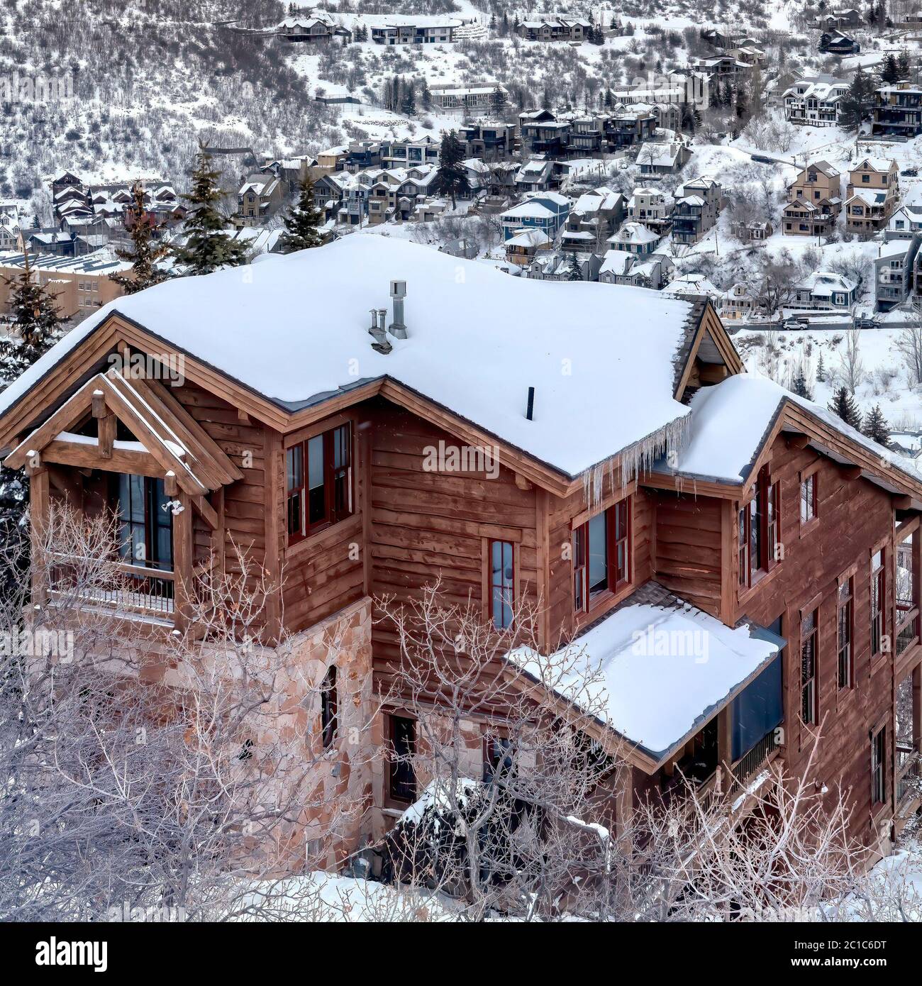 Square crop Home with snowy roof and wooden walls at the hill of Park ...