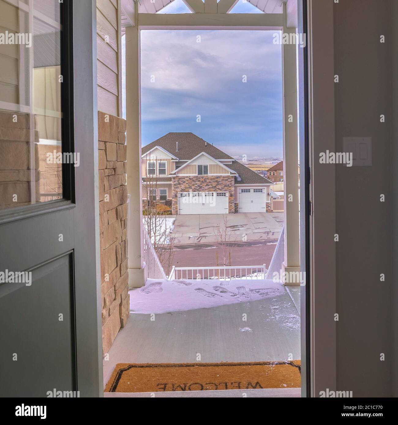 Square crop View through the open door from inside a home Stock Photo ...