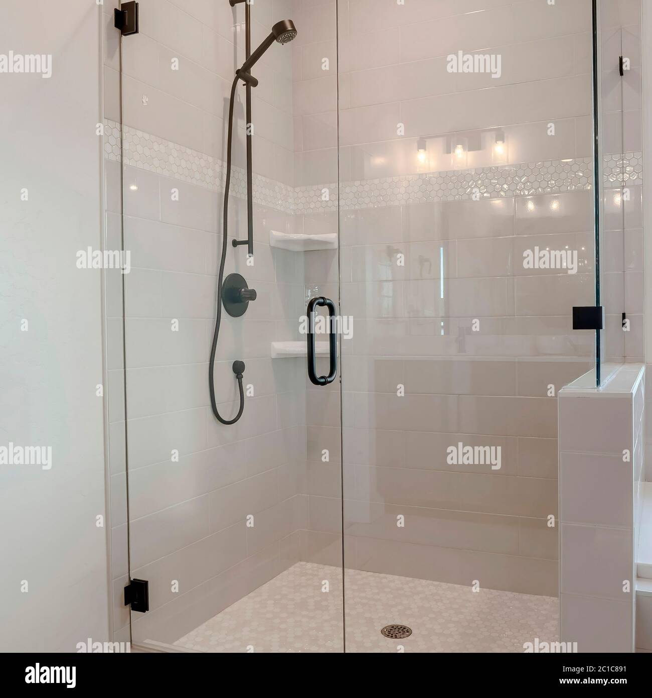 Square Bathroom shower stall with half glass enclosure adjacent to ...