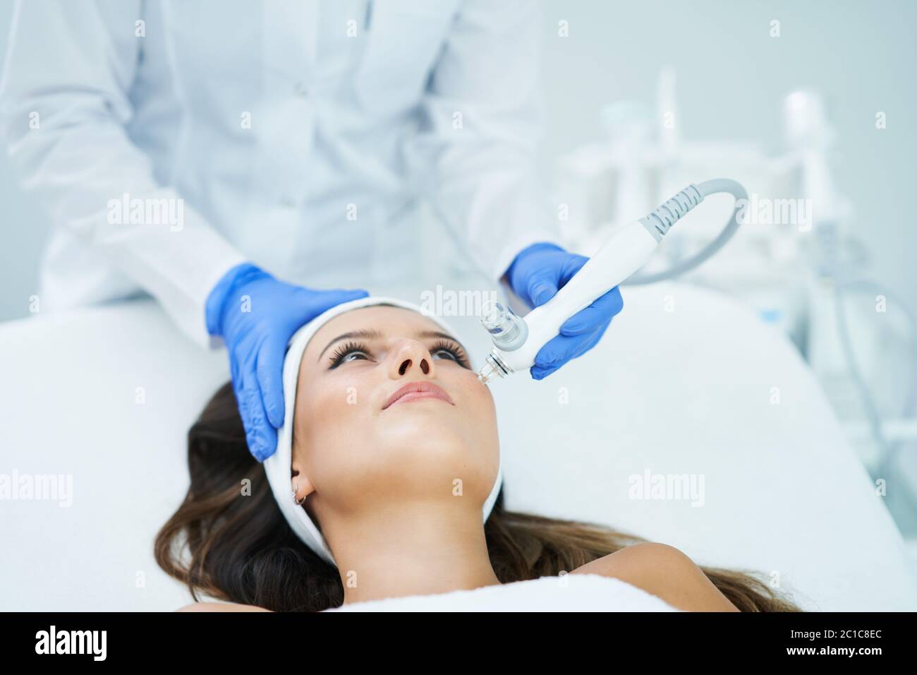 Beautiful young woman getting face treatment at beauty salon Stock ...