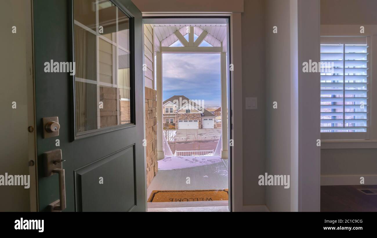 Panorama View through the open door from inside a home Stock Photo - Alamy