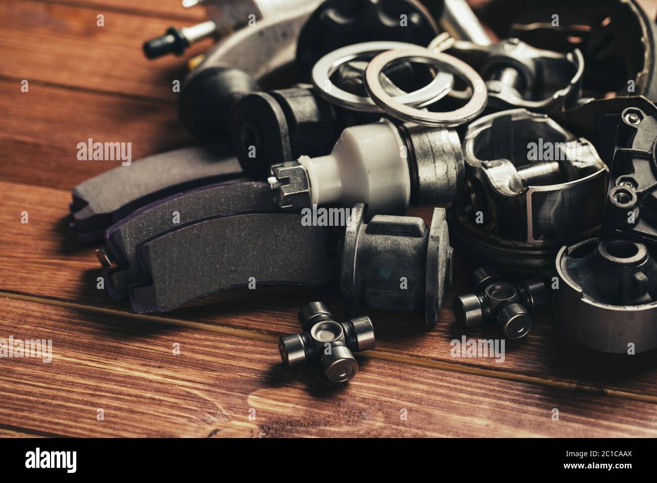 Various car parts on dark woooden background Stock Photo - Alamy