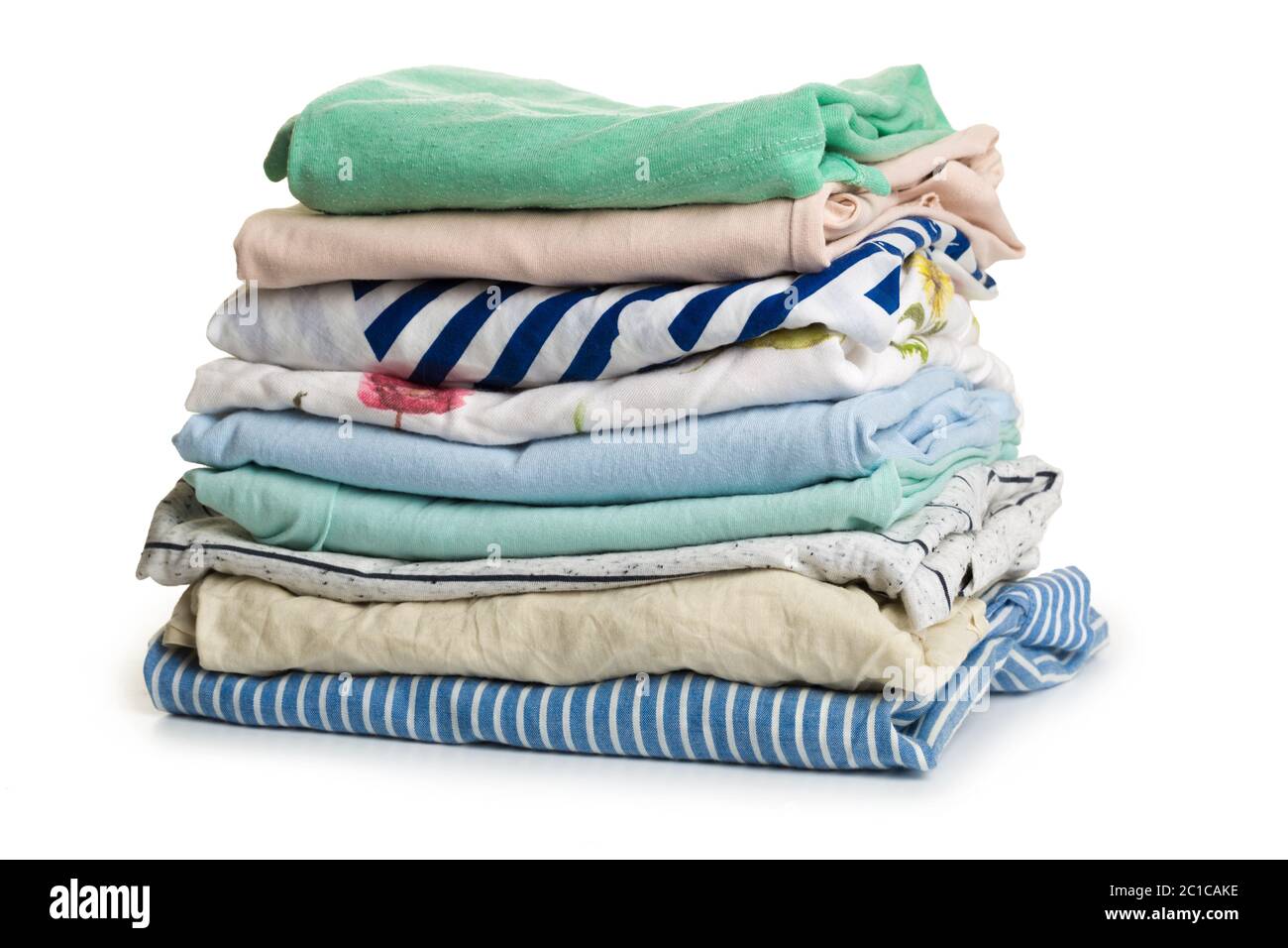 stack of clothing isolated on white background Stock Photo - Alamy