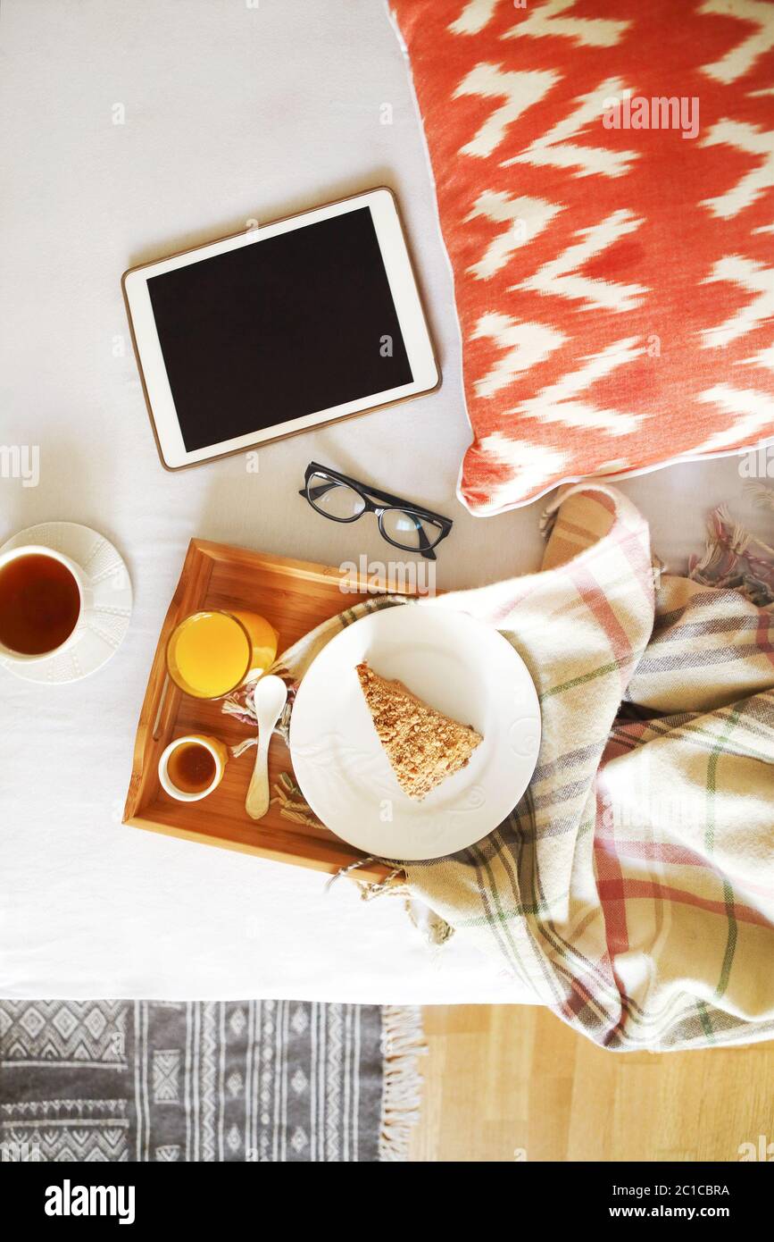 Cozy breakfast in bed with tea Stock Photo - Alamy
